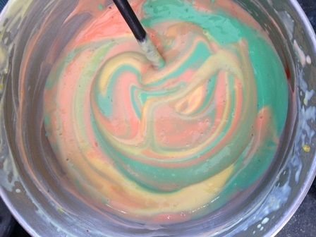 adding food coloring to paint