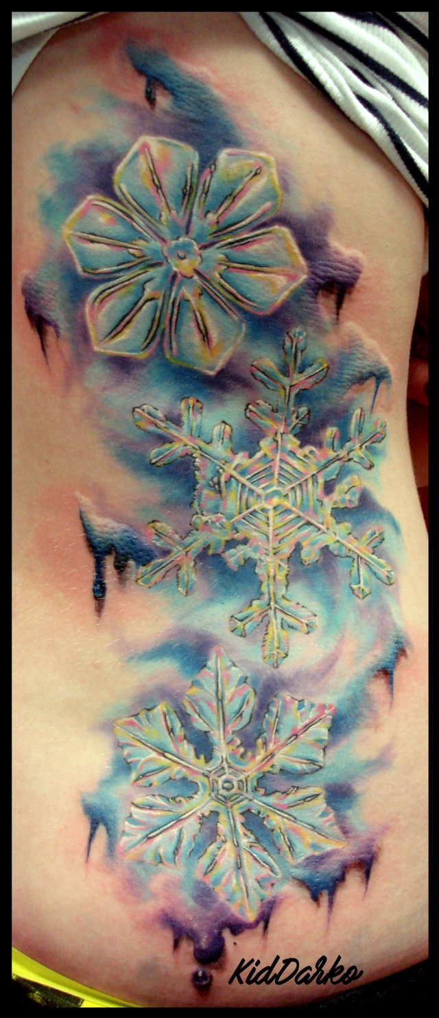 Snowflake Rib Tattoos 8 Best Snowflake Tattoo Designs: Charming Winter
