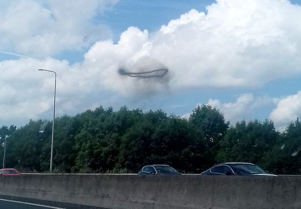 Explained: Mysterious black 'smoke ring' spotted hovering above the sky ...